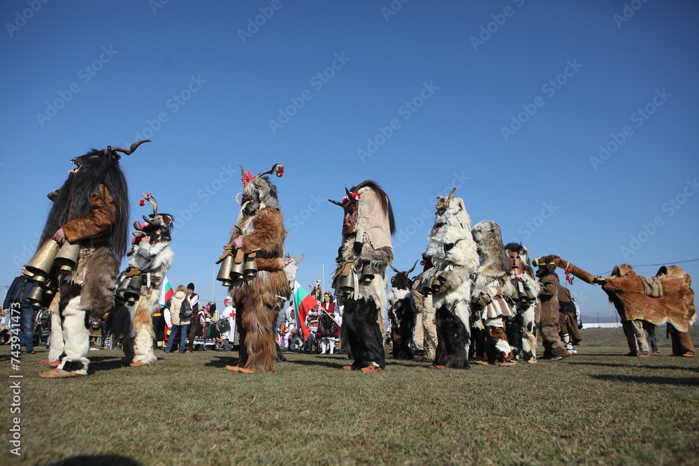 People called Kukeri parade in masks and ritual costumes, perform ...