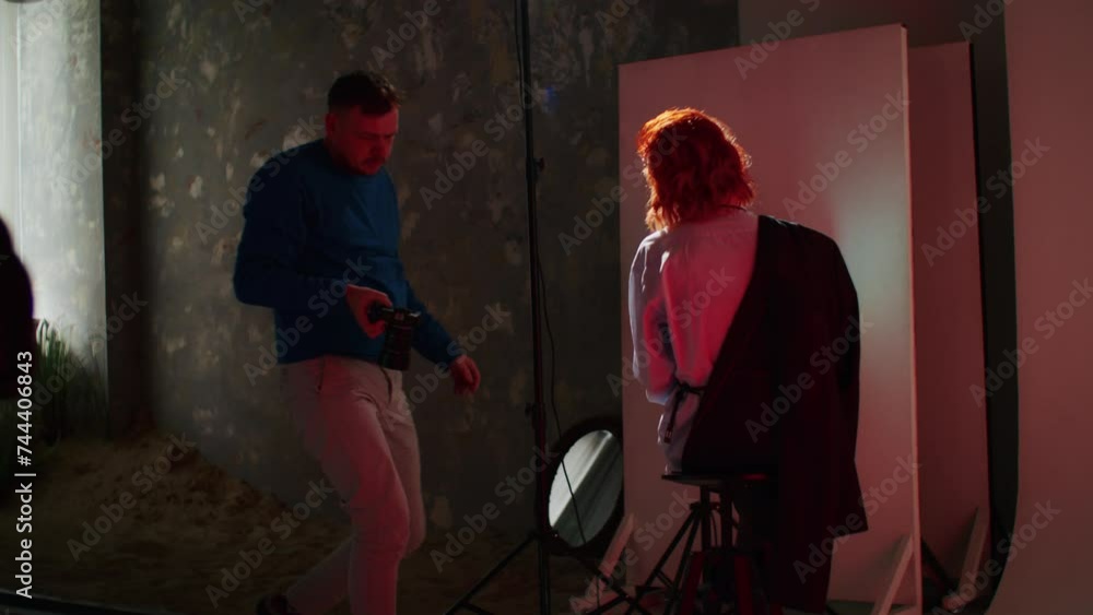 Photography session with a male photographer reviewing camera settings ...