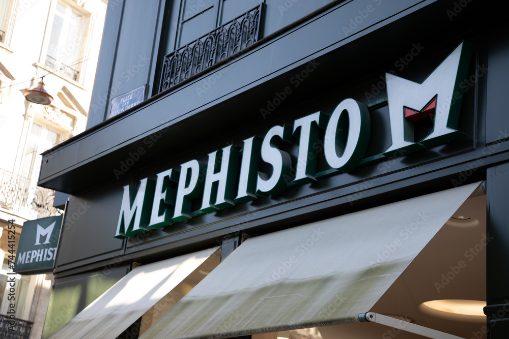 Mephisto sign logo green and brand text chain shop wall facade of shoes ...