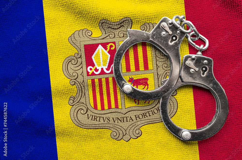 Flag of Andorra and police handcuffs. Crime and offenses in country ...