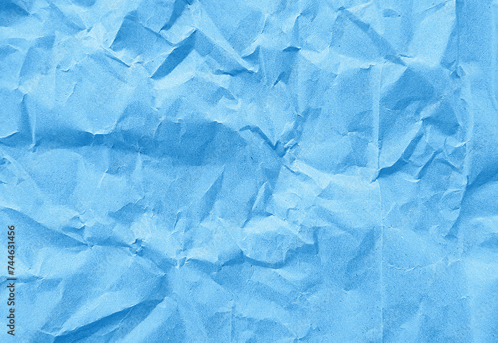 close up texture of light blue crumpled or torn old craft paper use as ...