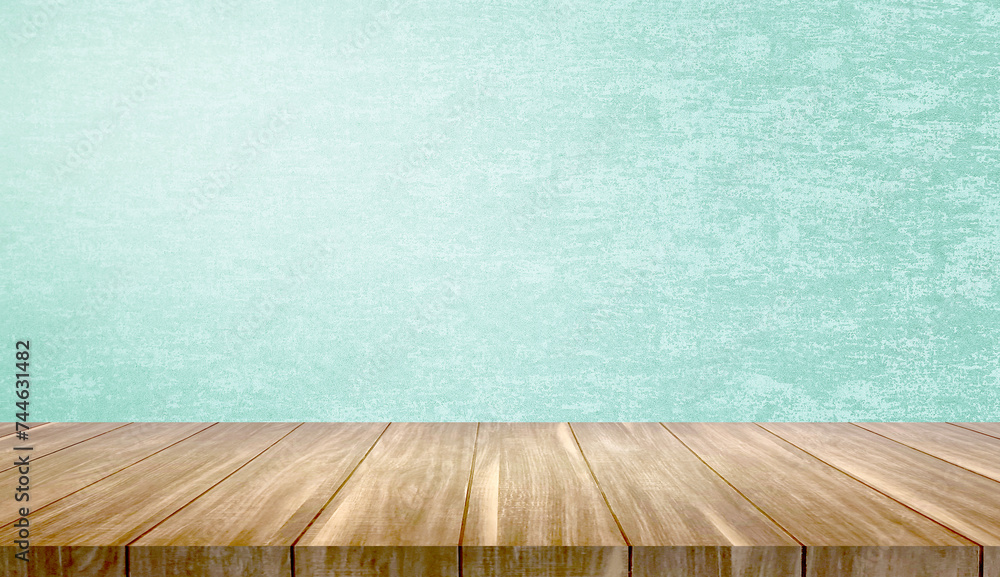 empty wood table at foreground with mint color fabric wallpaper at ...