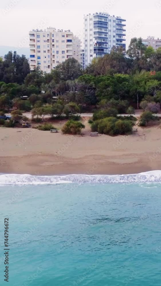 Drone footage captures sea, beach, town from air, approaching ...