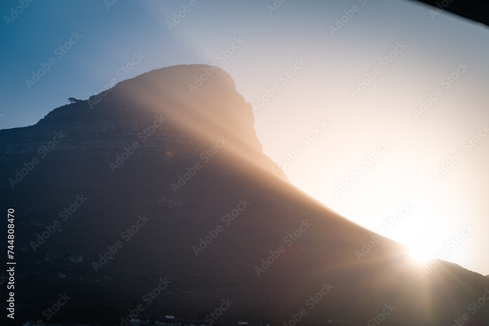 Sun setting behind Signal Hill in Cape Town, South Africa Stock Photo ...