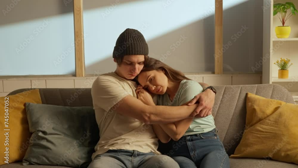 Portrait of man and girl in the room sitting on the couch. Couple ...