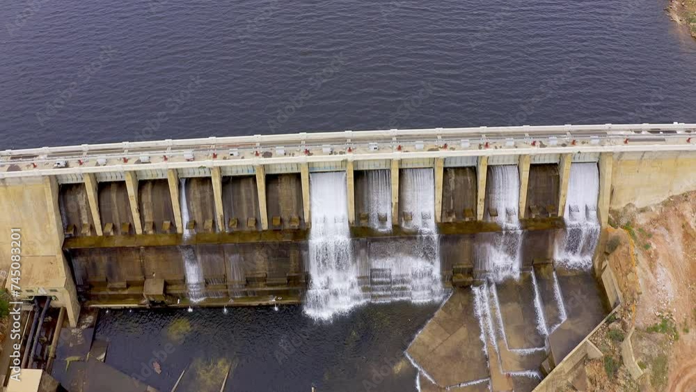 Drone, dam and water with wall, infrastructure in industrial landscape ...