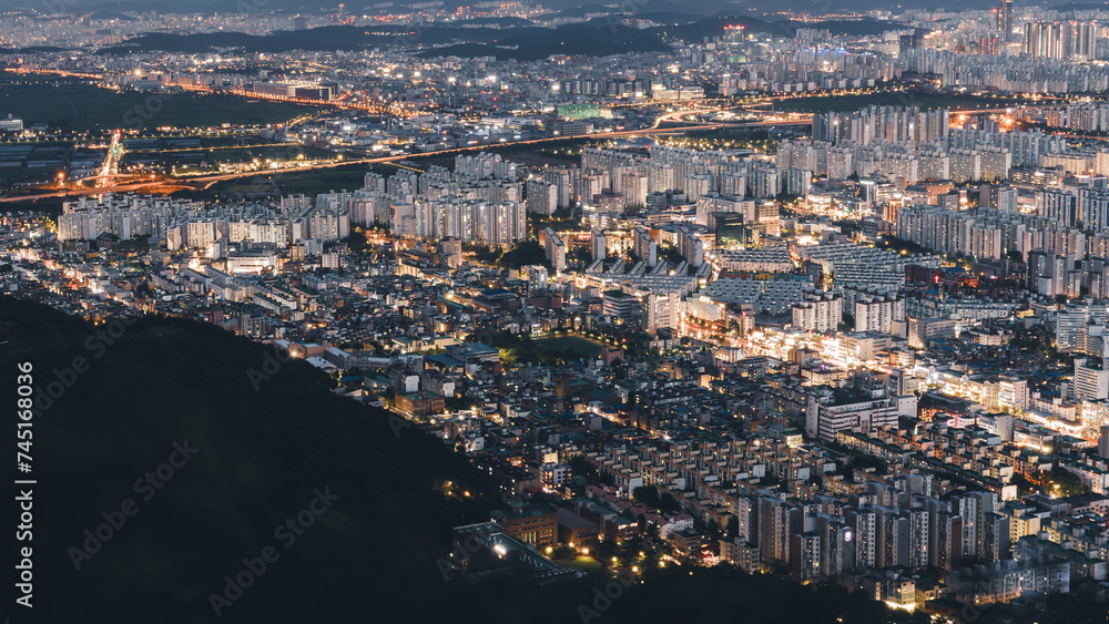 night view city lights urban sprawl illuminated streets high-rise ...