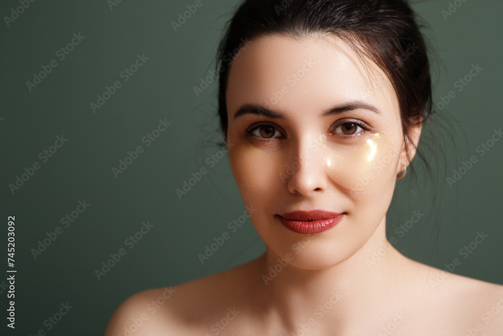 Portrait of a cute beauty girl with translucent silicone patches under ...