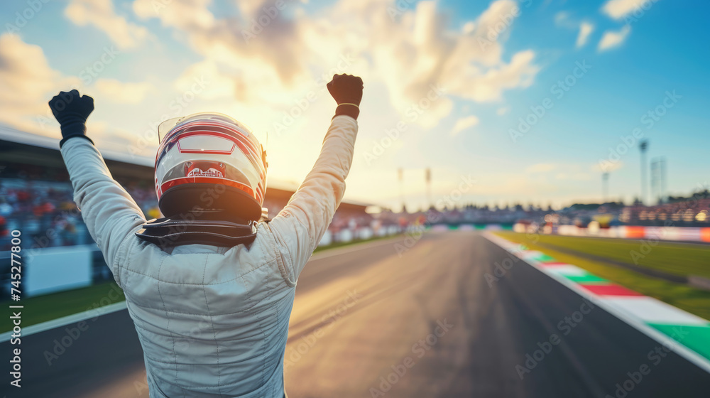 Poster, Foto A victorious race winner, donned in a helmet, celebrates ...
