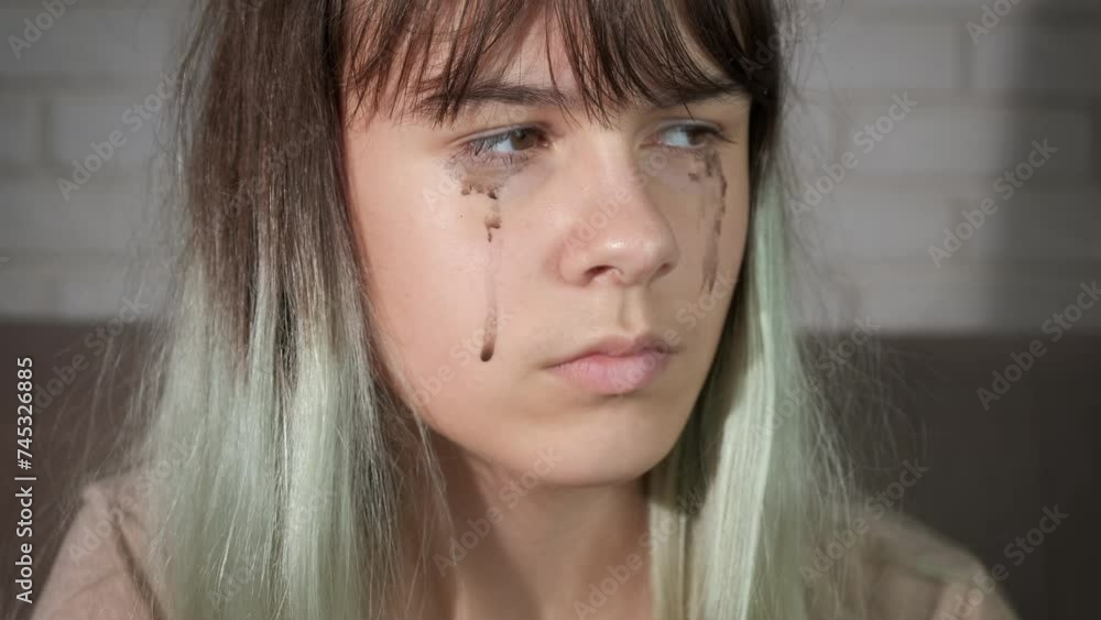 Vidéo Stock Crying teen girl in lonely. A modern upset teen girl with ...