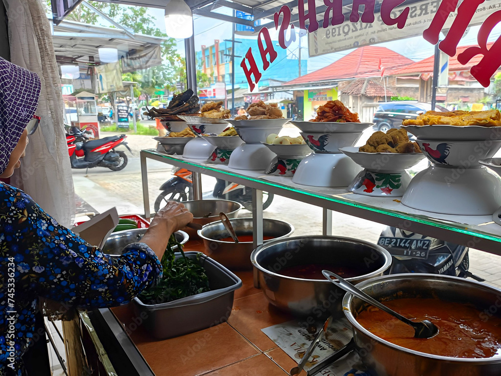 Delicious dishes of typical Padang food with a neat layout and ...