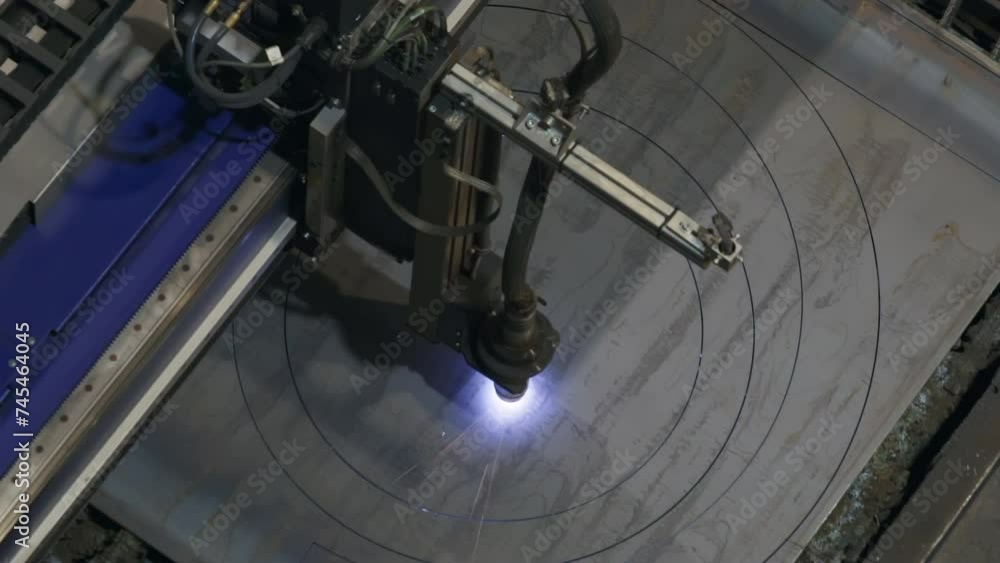 Automated metalworking equipment cutting the long sheet of steel ...