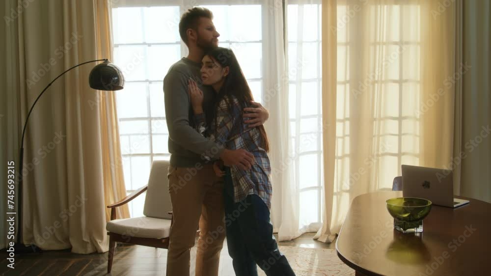 love couple calm down hugging after emotional conflict and quarrel. young man cuddle tight his ...