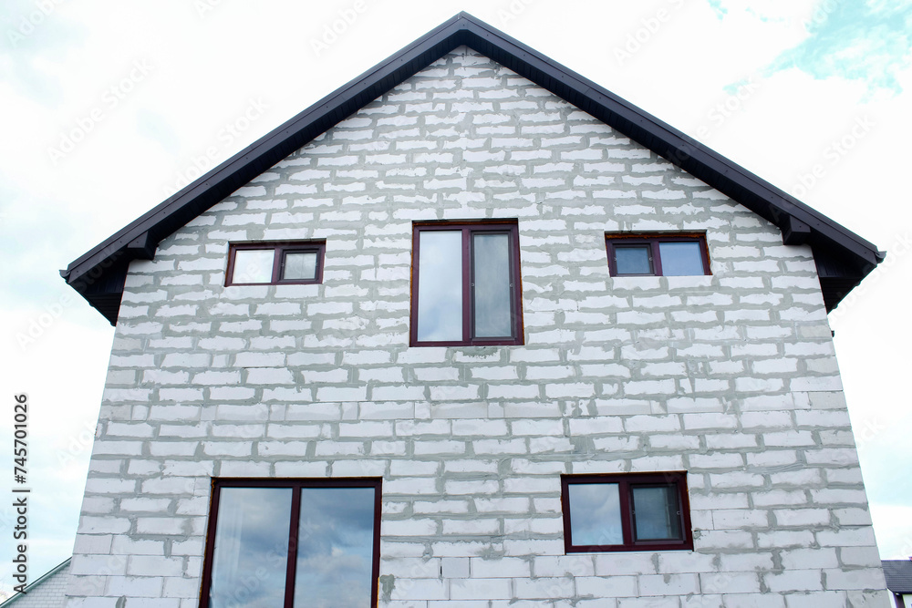 A house without a facade built from gas blocks. Construction concept. A ...
