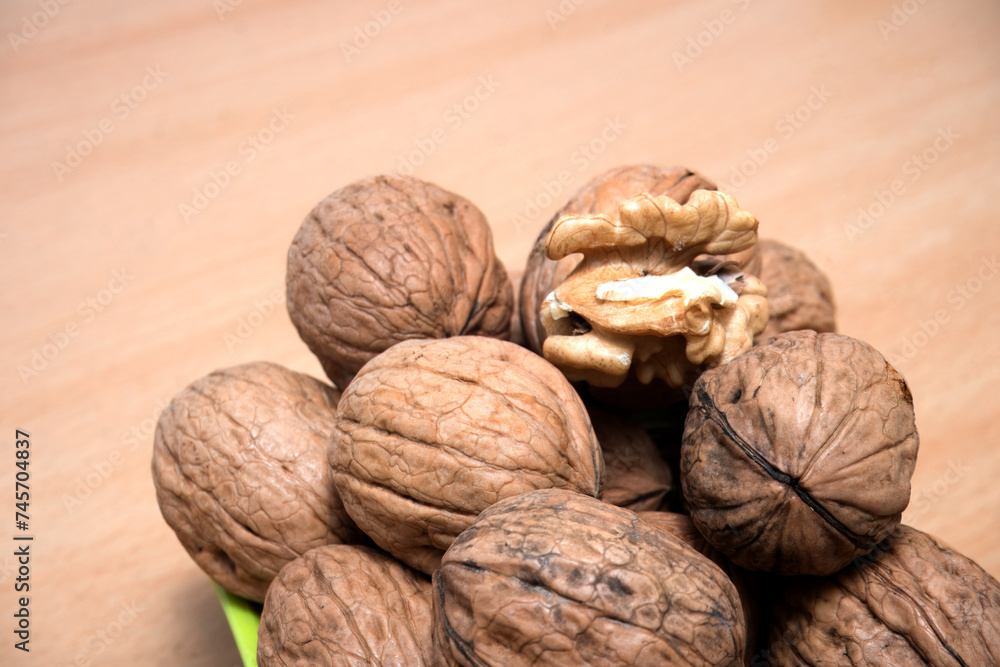 Cracked Walnut Showcasing Kernel Amidst Whole Ones, This image ...