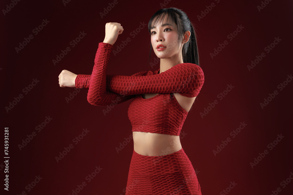 Energetic Asian fit slim good shape body building athletic woman in red ...
