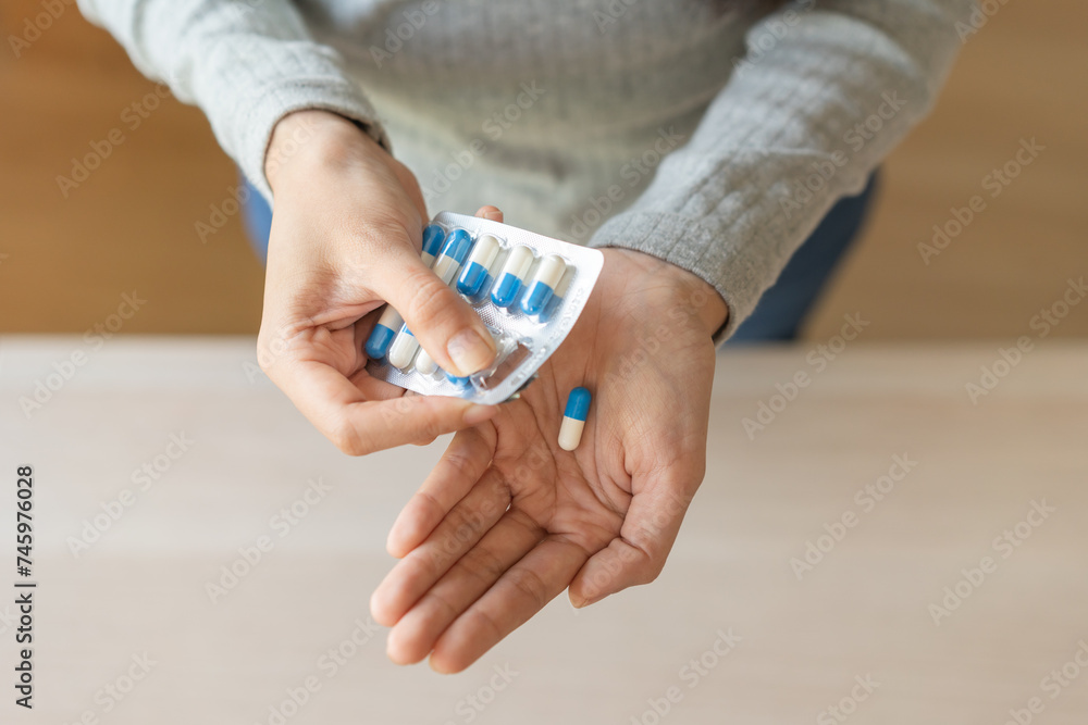 Health care. Sickness, illness asian young woman hand holding, take ...