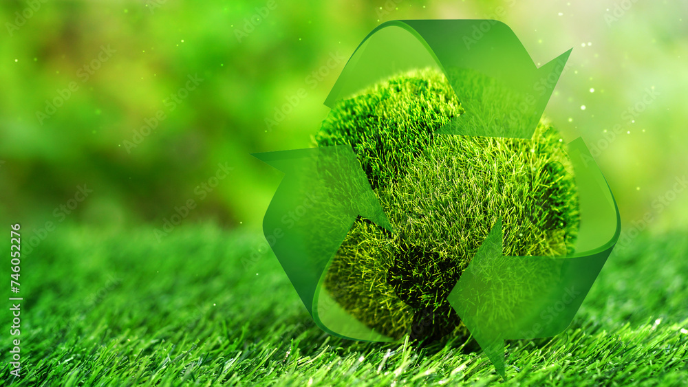 Green earth cover with the Recycle symbol on green grass field in ...