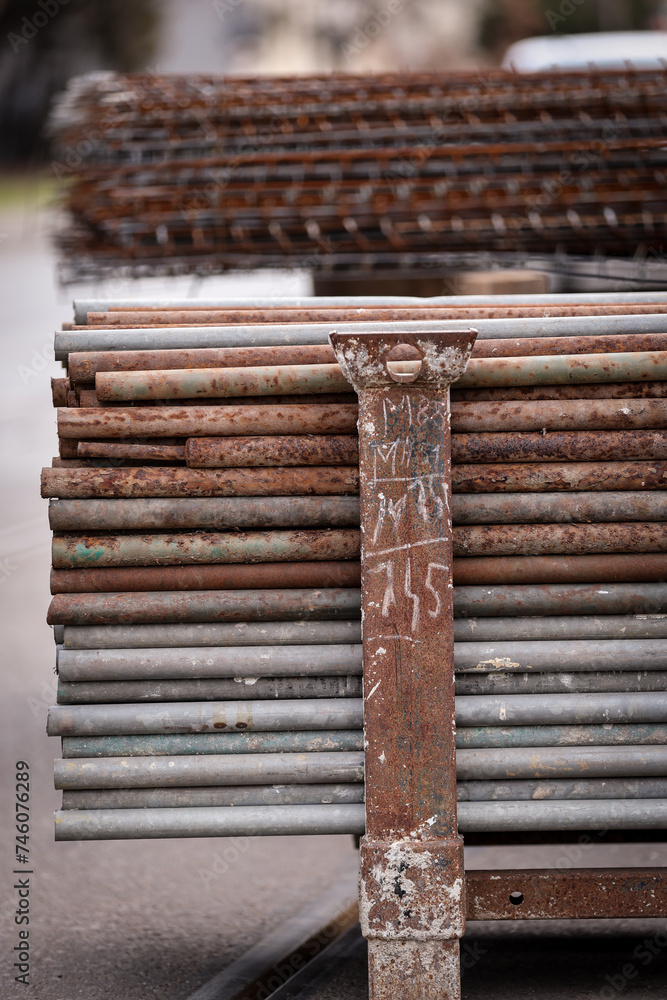 Big stack of iron bars used in road construction and tram rail ...