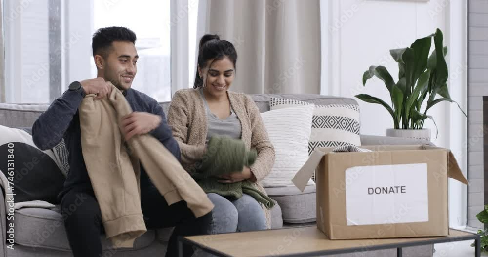 People, face and charity by clothes in home, donation and kindness with ...