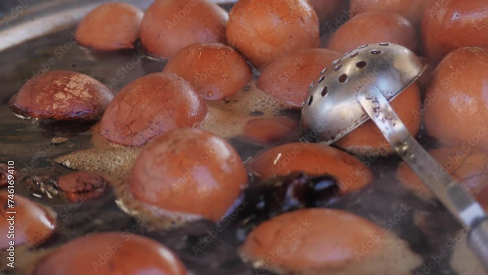 Chinese century eggs or tea egg in boiling water close-up. Chinese egg ...