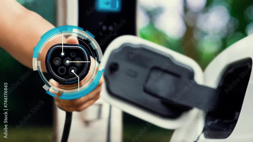 Focus EV charger pointing in front of camera display futuristic smart ...