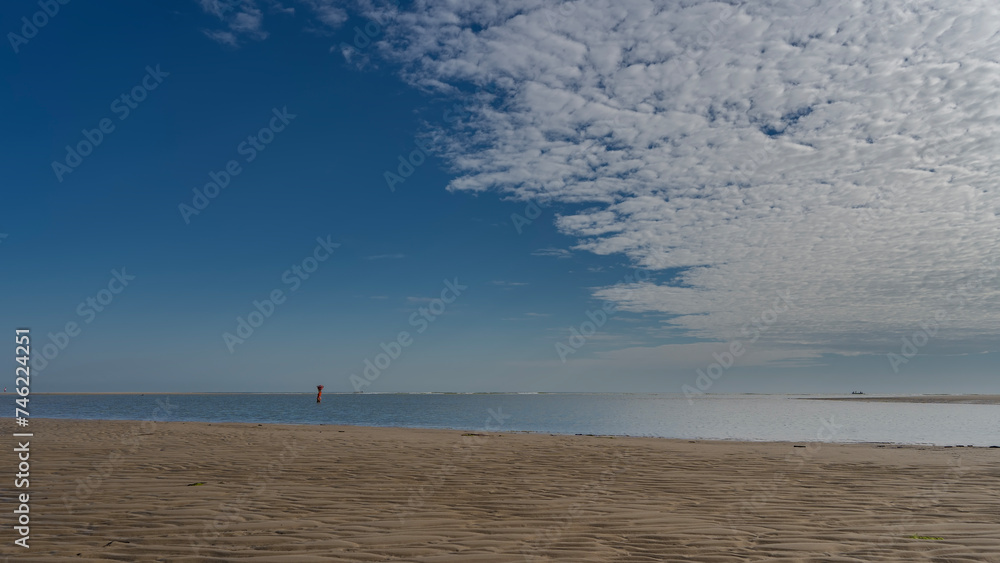 The low tide in the ocean. The undulating sandy seabed was exposed. In ...