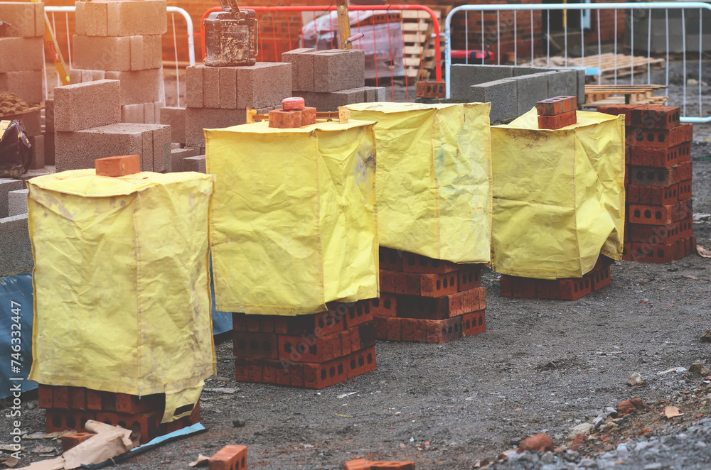 Red bricks and concrete blocks delivered on construction site and ...