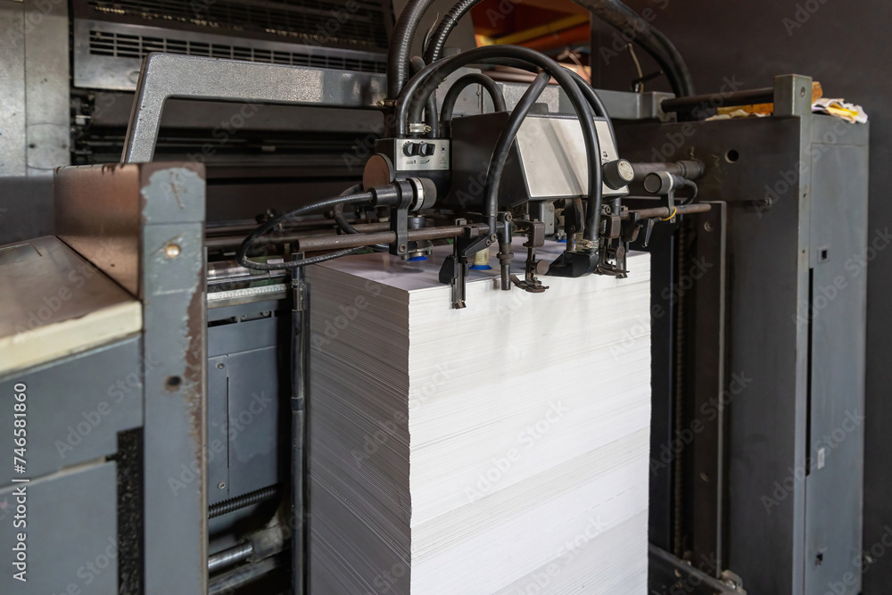Printed sheets of paper are served in the printing press. Offset , CMYK ...