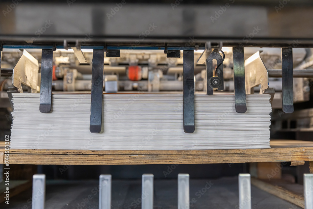 Printed sheets of paper are served in the printing press. Offset , CMYK ...