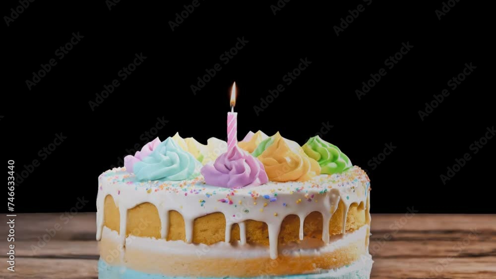 A delicious birthday cake and a animated burning candle on it. Alpha ...