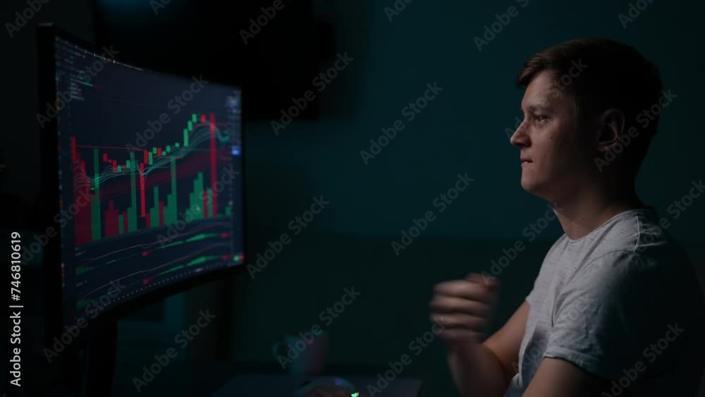 Happy excited male trader pounding fist on chest encouragingly in time ...