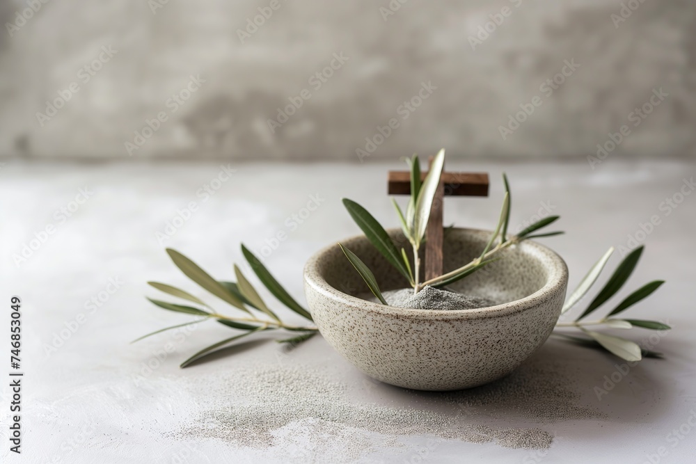 A small bowl featuring a cross on top, possibly representing a ...