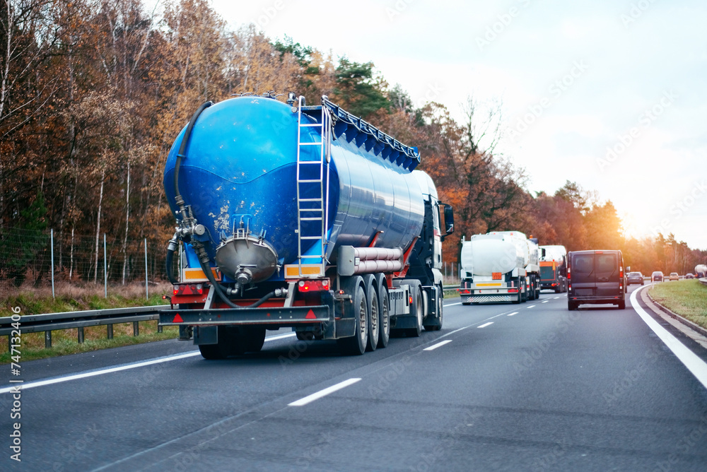 Petrol truck on highway hauling fossil oil refinery products. Fuel ...