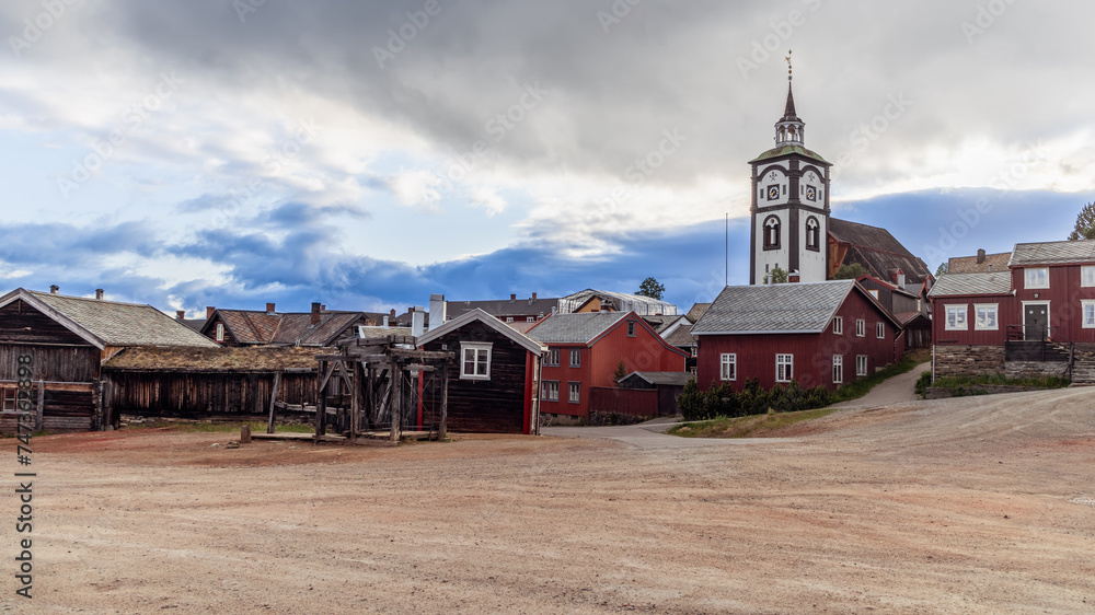 Panoramic scene in Roros with the old mine elevator and iconic red ...
