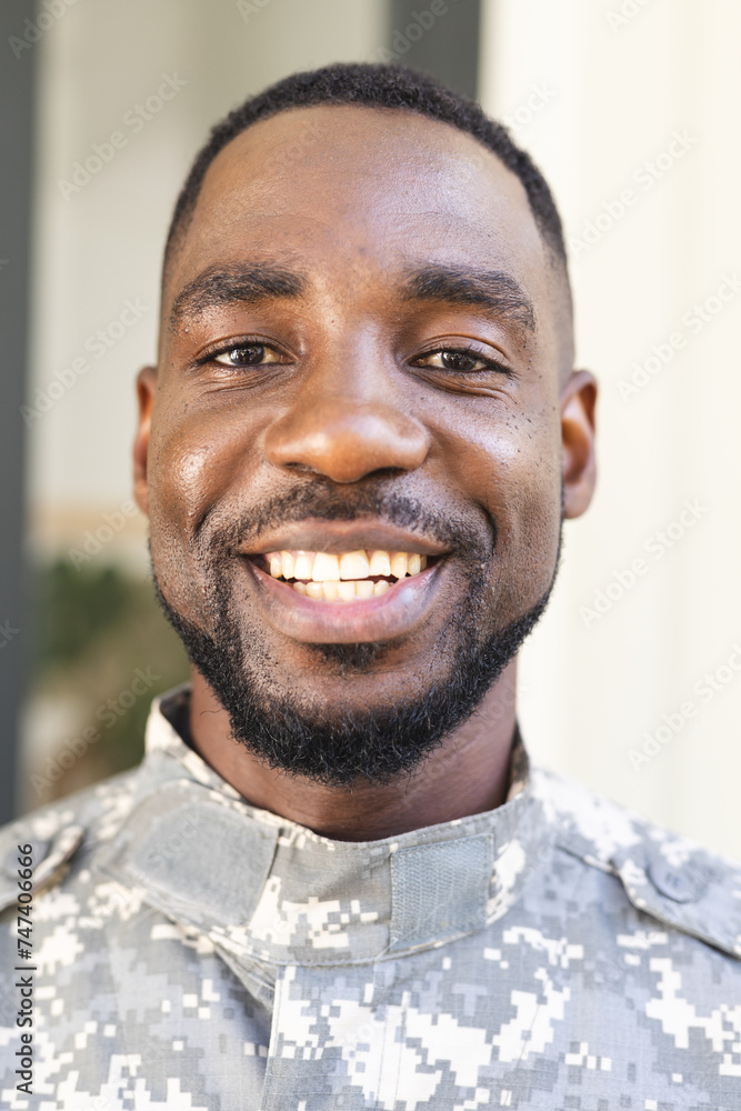 African American soldier smiles warmly, wearing a military uniform ...