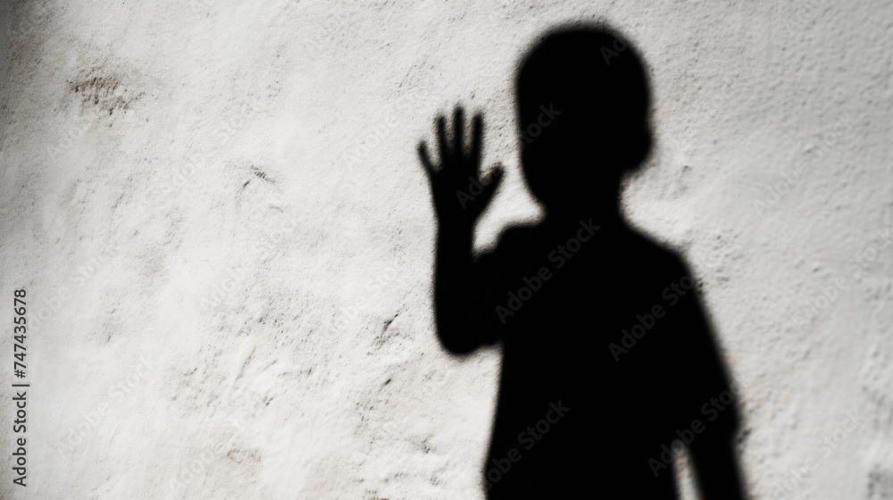 Illustration concept depicting the shadow of a child with a raised hand ...