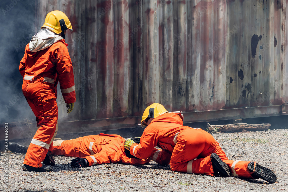 First aid support accident at work. Firefighter to save girl in fire ...