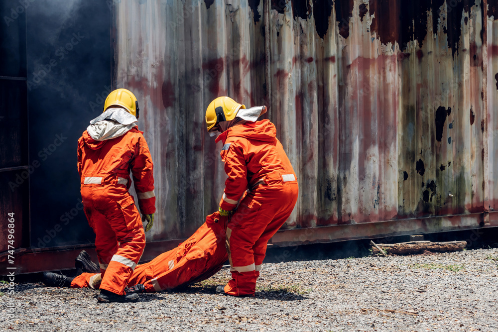 First aid support accident at work. Firefighter to save girl in fire ...