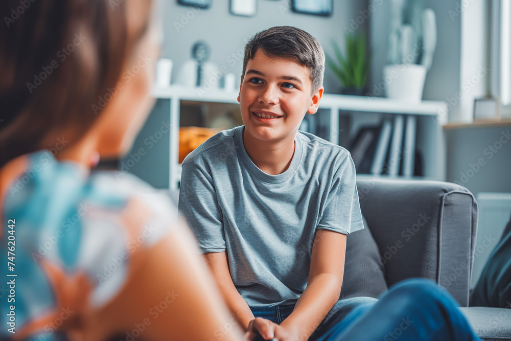 Therapist, psychology and boy on a chair, talking and child development ...