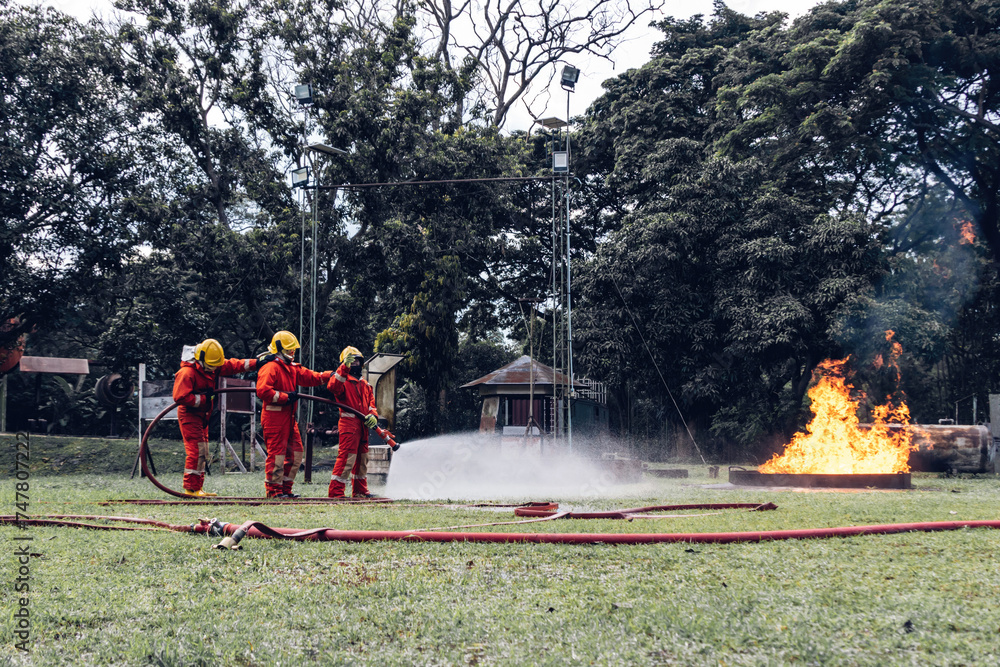 Firefighter Concept. Several firefighters go offensive for a fire ...