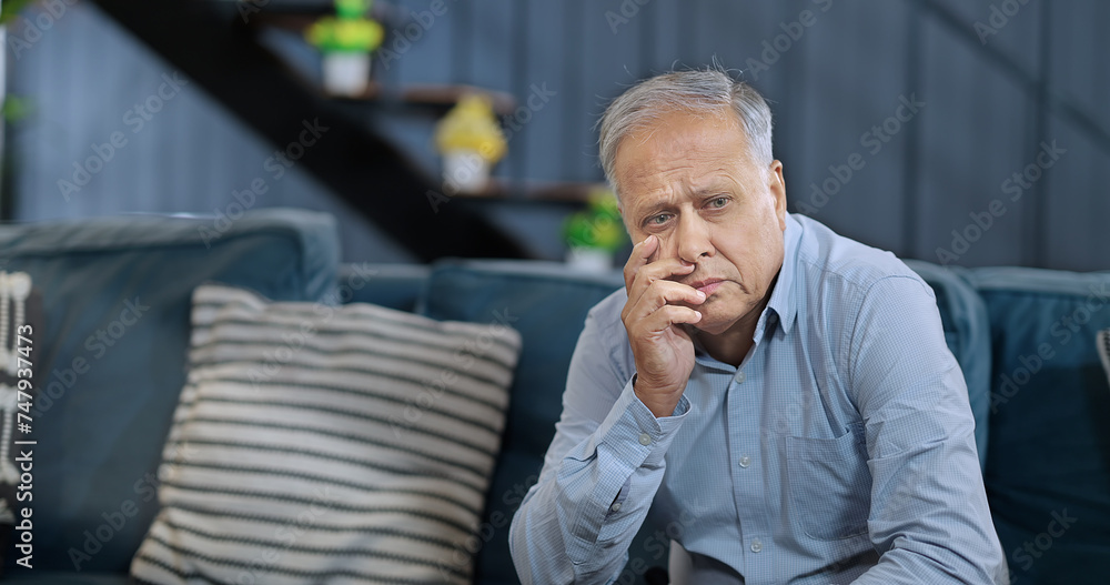 Asian India retired old elder gen x tired upset sad man sitting alone ...