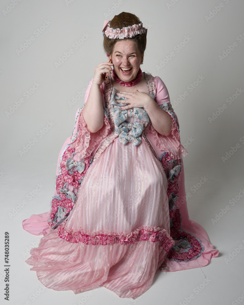 Full length portrait female model wearing opulent pink gown costume of ...