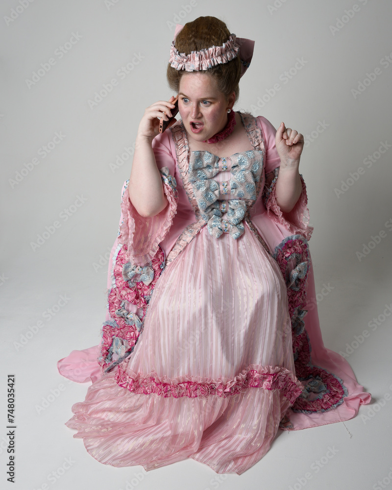 Full length portrait female model wearing opulent pink gown costume of ...