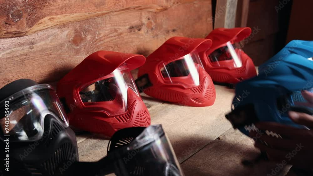 protection masks, Paintball combat, Game gear. Row red and blue ...
