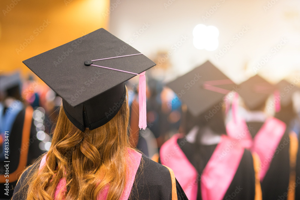 Graduation Ceremony with Students in Cap and Gown. Back view of ...