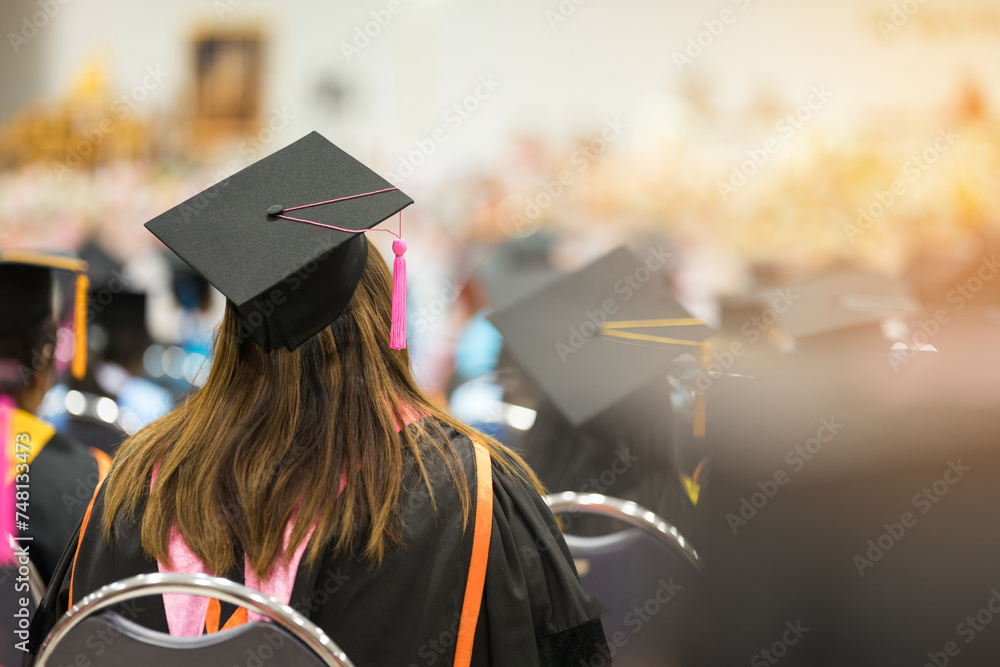 Graduation Ceremony with Students in Cap and Gown. Back view of ...