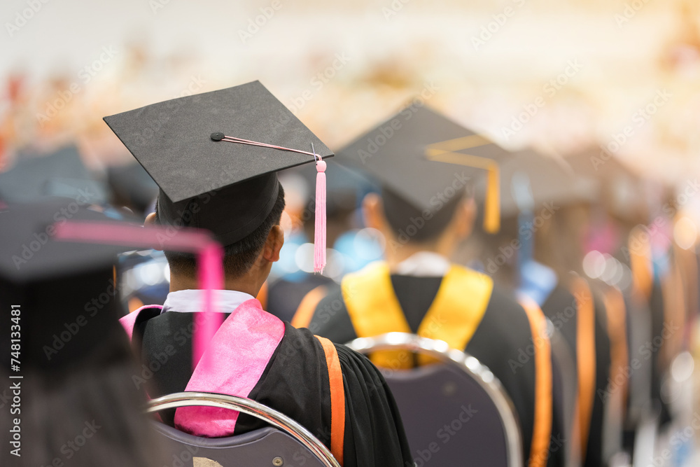Graduation Ceremony with Students in Cap and Gown. Back view of ...