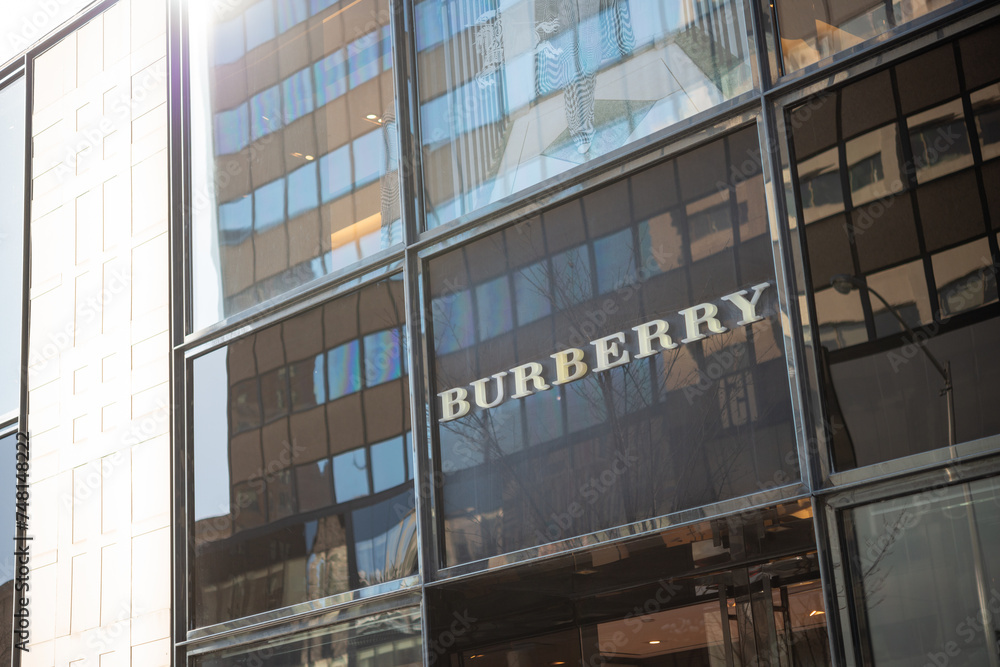 exterior building facade and sign of Burberry, a clothing store ...