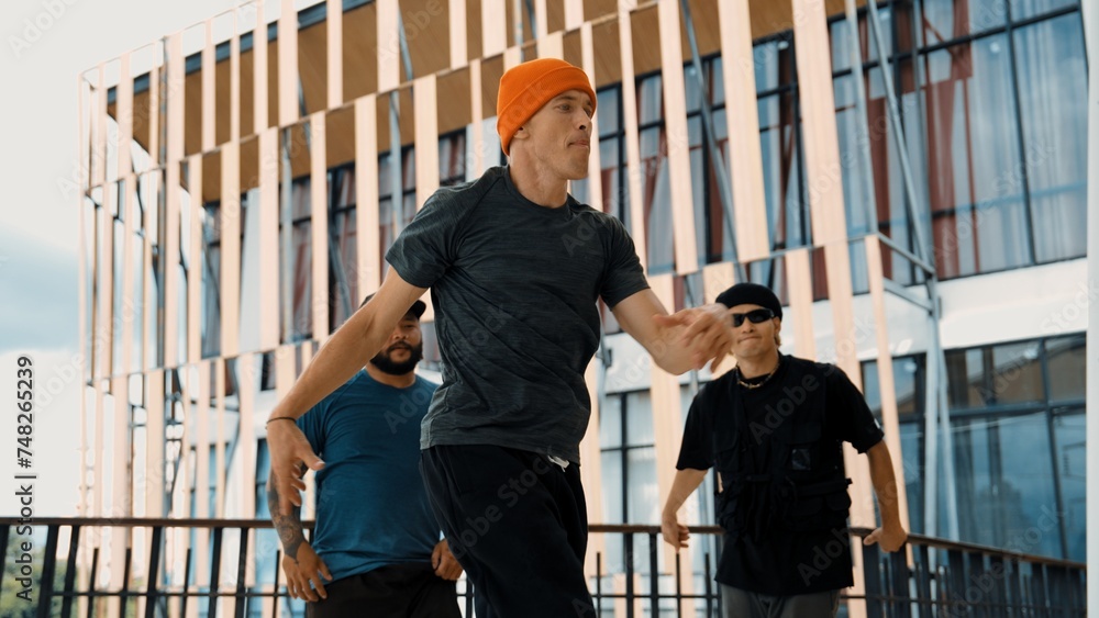 Hip hop team dance break dance while multicultural friend surrounded ...